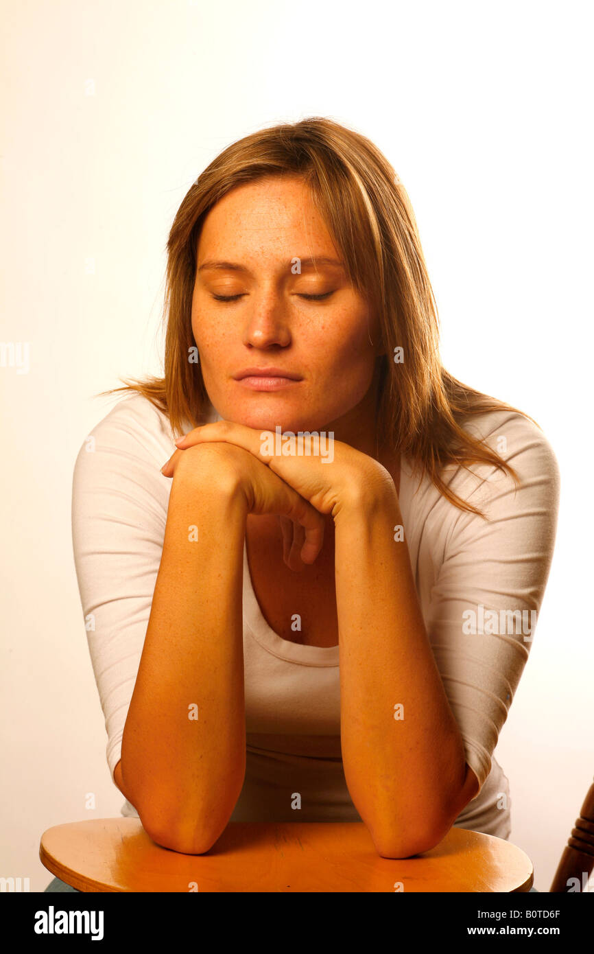 Relaxed looking young woman Stock Photo - Alamy