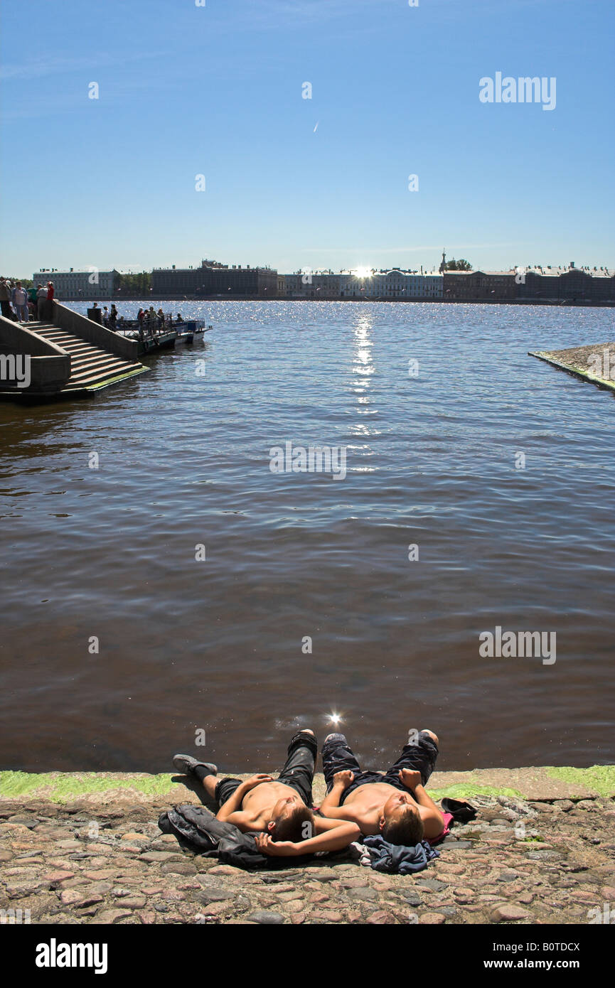 Two Men Sunbathing High Resolution Stock Photography and Images - Alamy