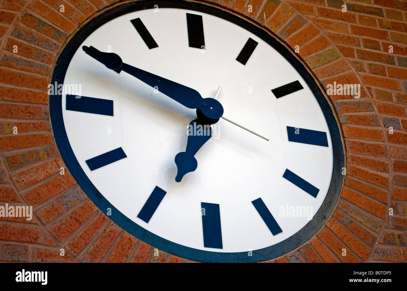 Analog clock on a Brick wall Stock Photo - Alamy