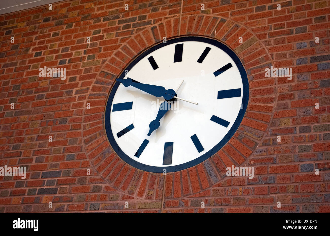Analog clock on a Brick wall Stock Photo - Alamy