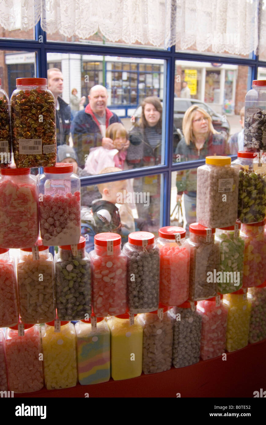 People Looking Through The Window Of A Traditional English Sweet Shop ...