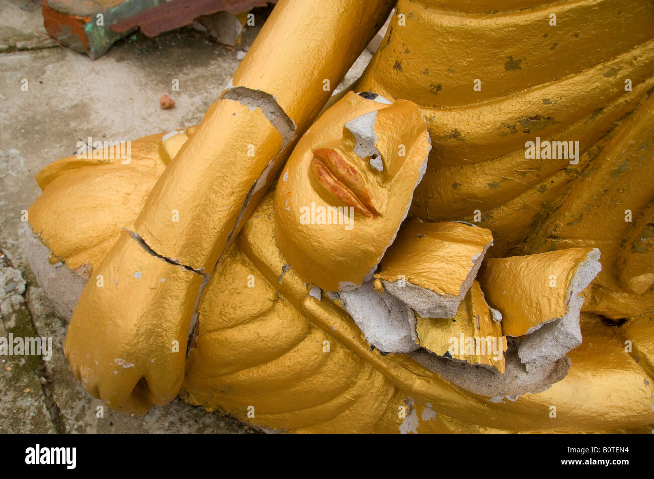 A large Buddha statue stands in a ruined temple caused by Cyclone ...