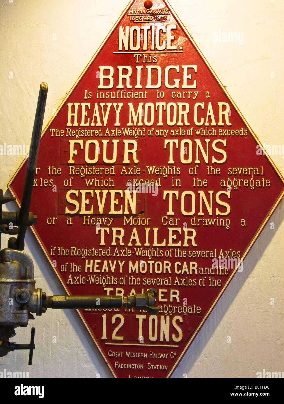 Historic road sign showing weight limits of vehicles intending to use a ...