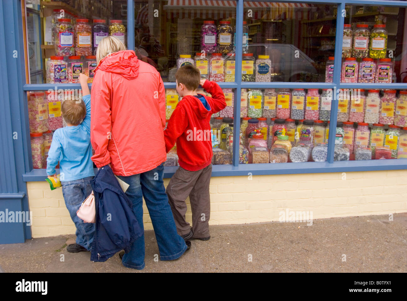 Family Viewing Sweets At Traditional English Sweet Shop in the uk Stock ...
