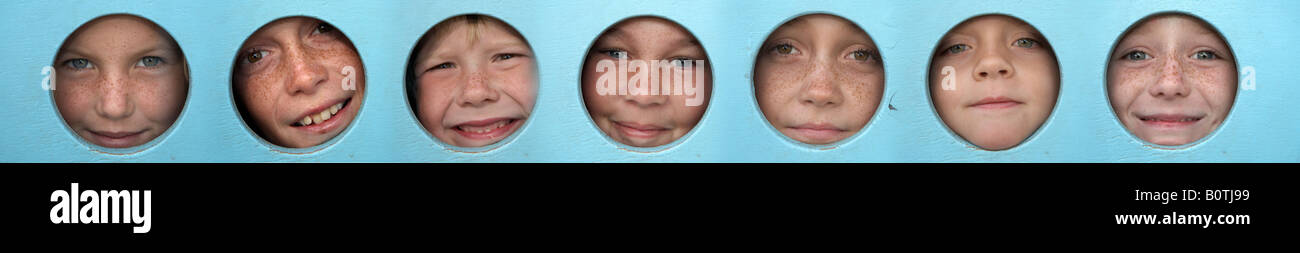 group of childrens faces at round windows Stock Photo - Alamy
