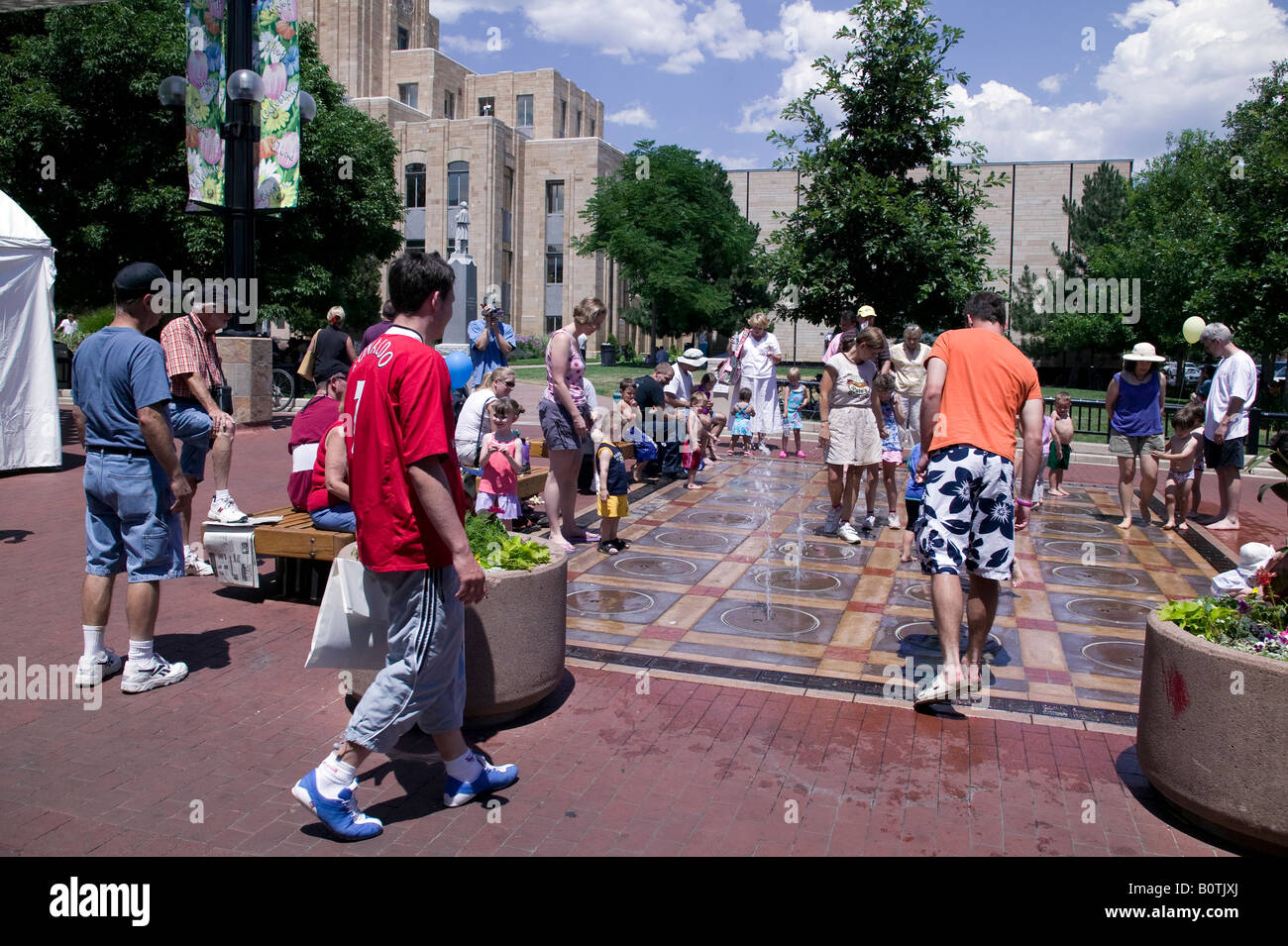 People playing in water fountains in Boulder Colorado Stock Photo - Alamy