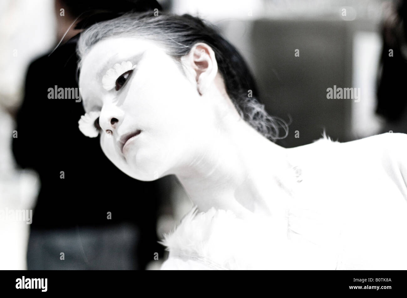 actress performing mimic with white make up and fake eyelush Stock ...