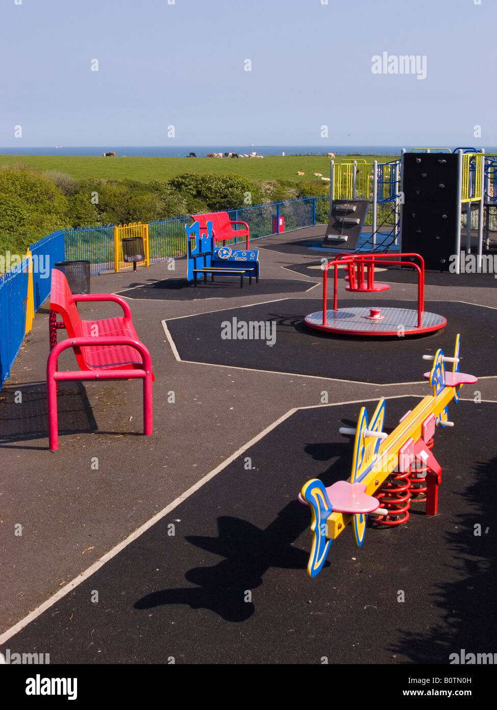 Good play environment children's playground with fields and the sea in ...