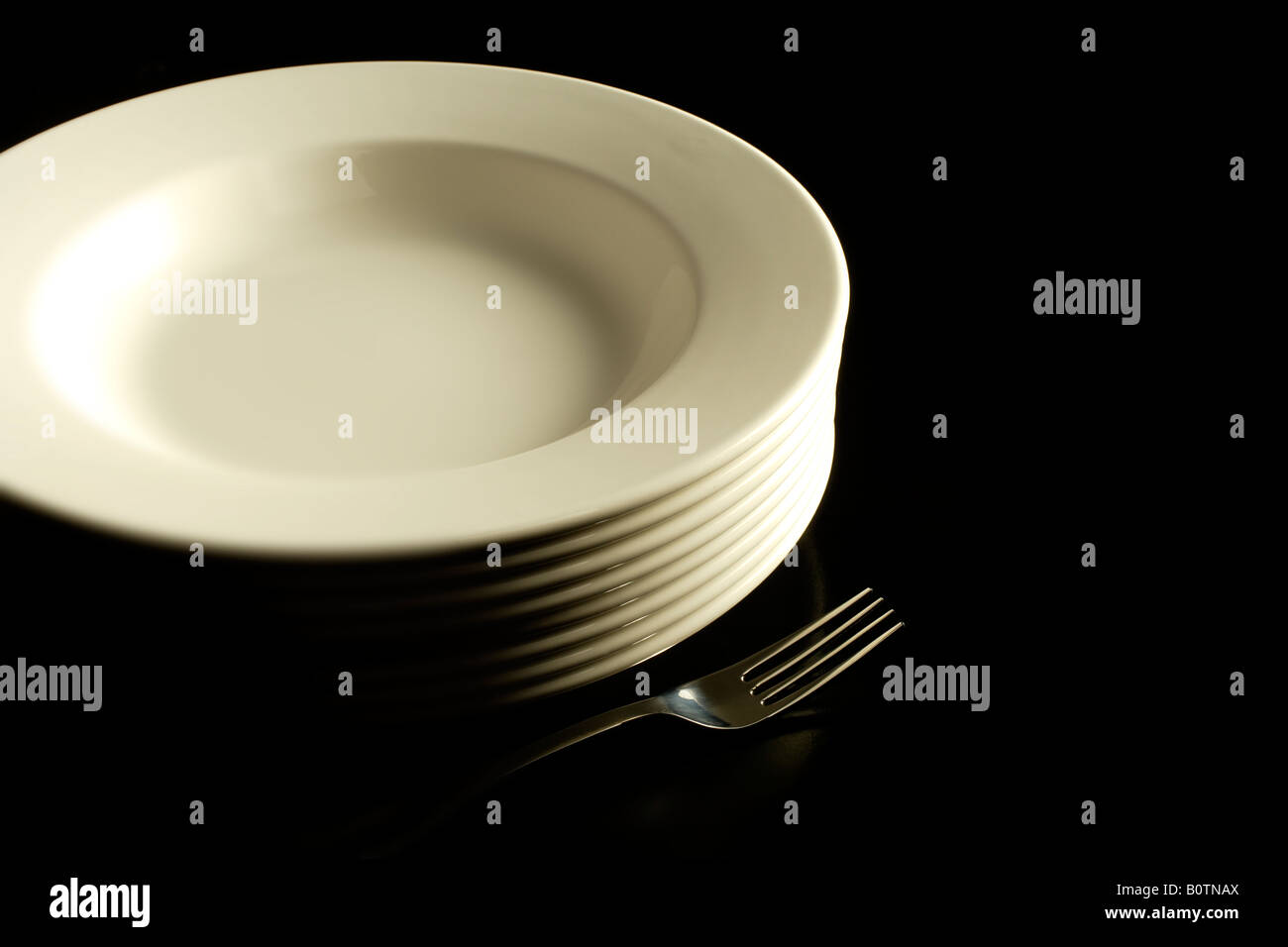 Empty black ceramic plates hi-res stock photography and images - Alamy