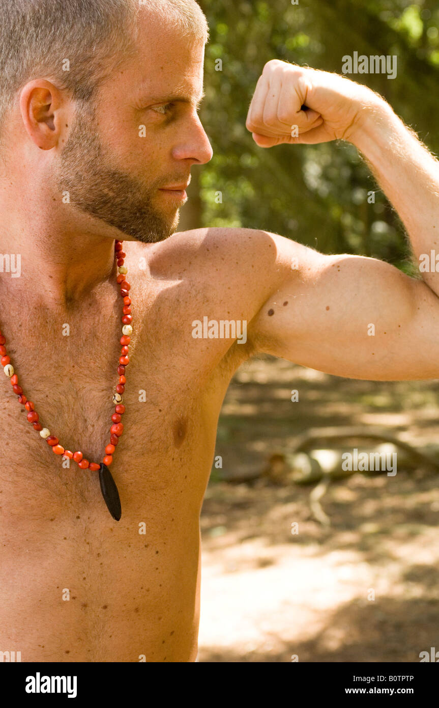 Man flexing his muscles Stock Photo - Alamy