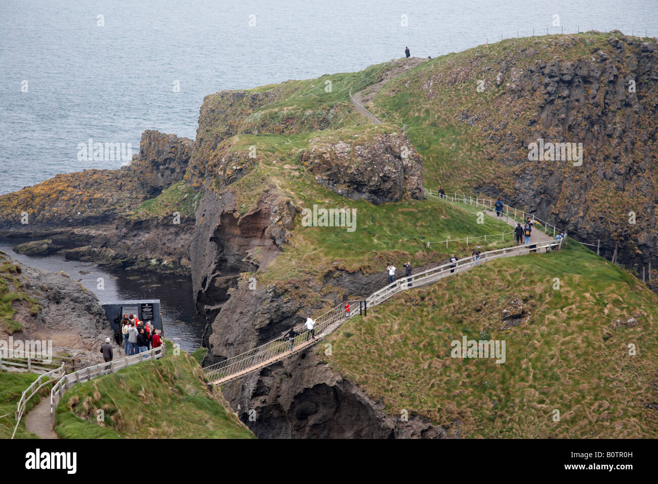 tourists queuing up to cross the carrick a rede rope bridge on the ...