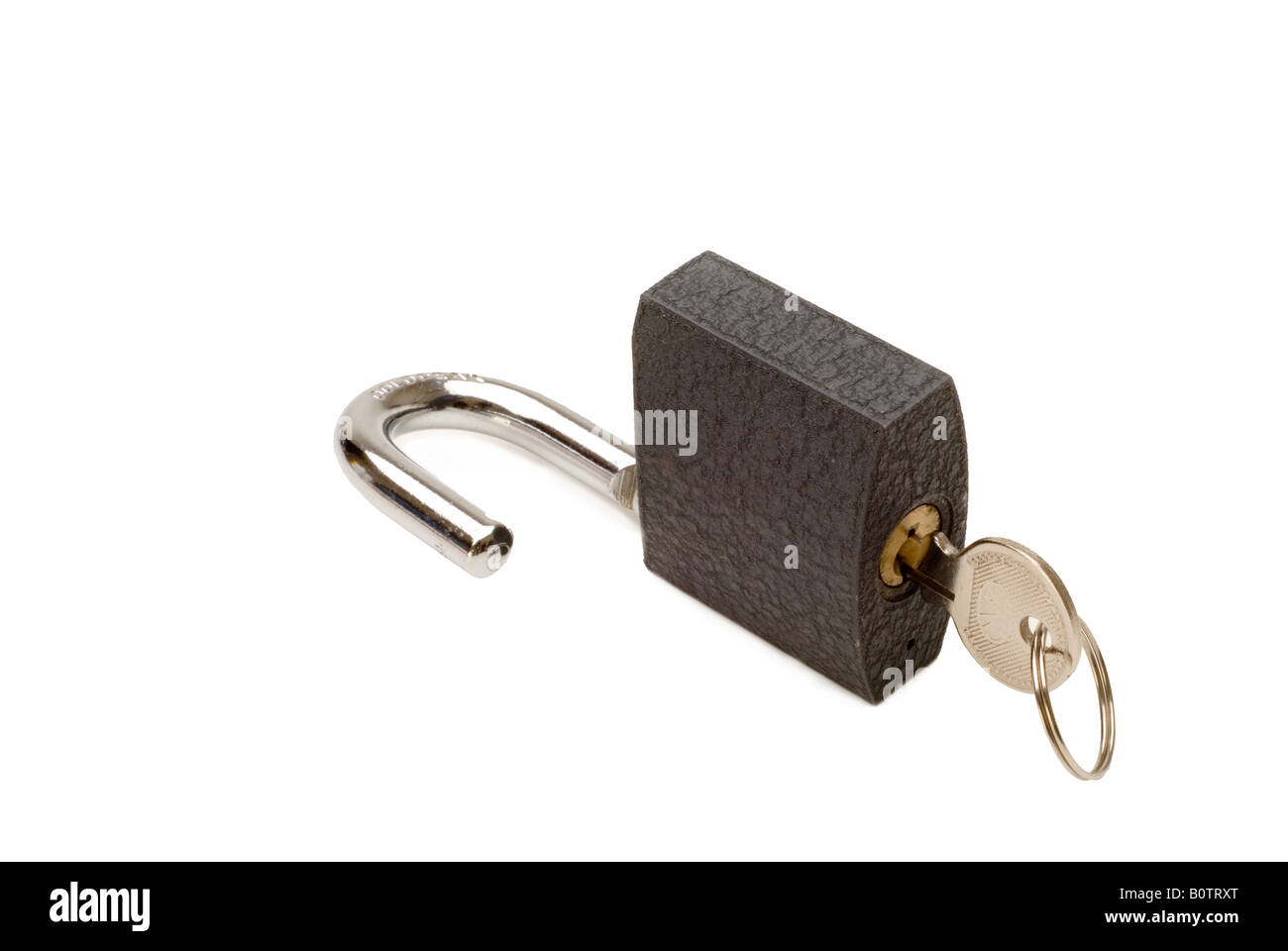 Key in lock on white background Stock Photo - Alamy