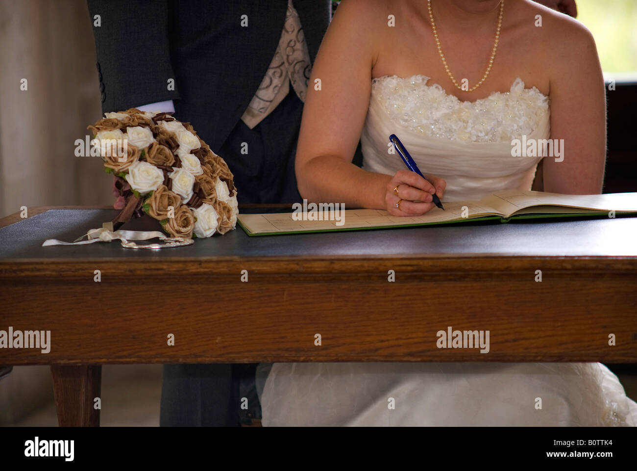 Signing register bride hi-res stock photography and images - Alamy