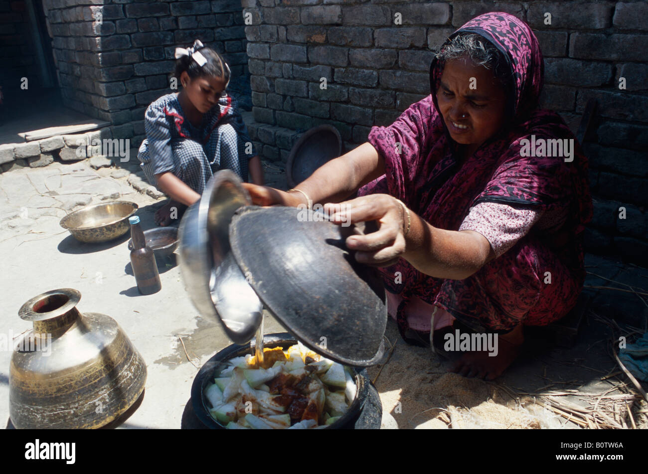 Preparing a meal rural Bangladesh Stock Photo - Alamy