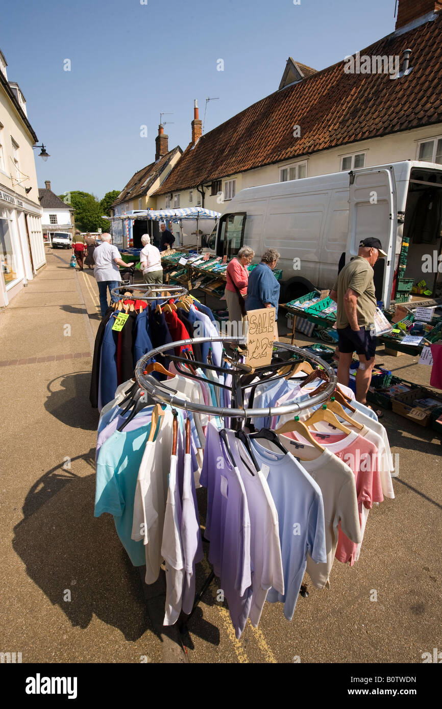 UK England Suffolk Saxmundham weekly market shoppers at clothing stall ...