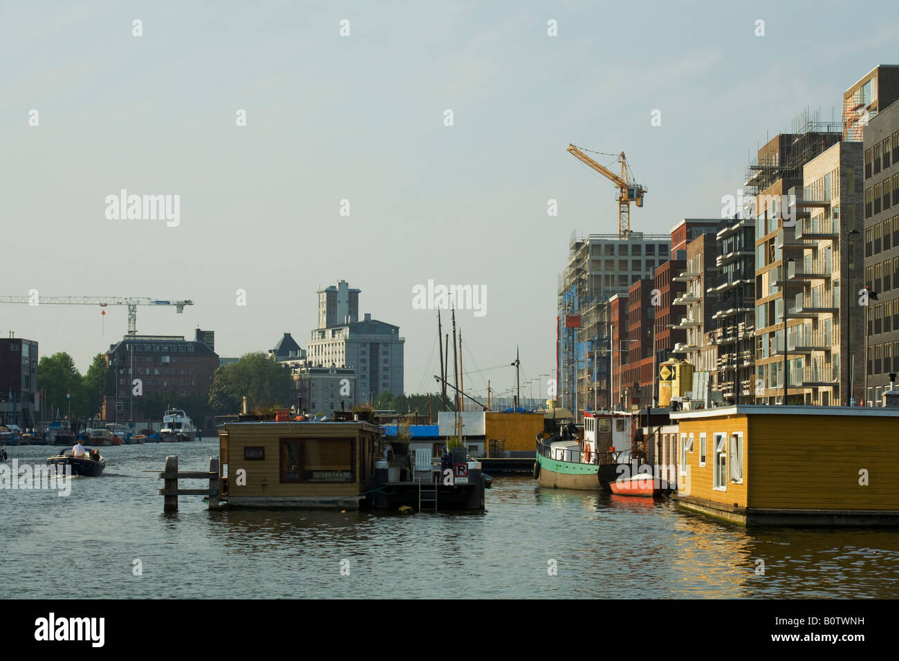 renovated area in Amsterdam Westerdok with boathouses Stock Photo - Alamy
