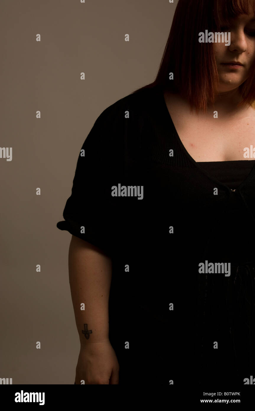 depressed sad overweight plus sized chubby fat young woman dressed in ...