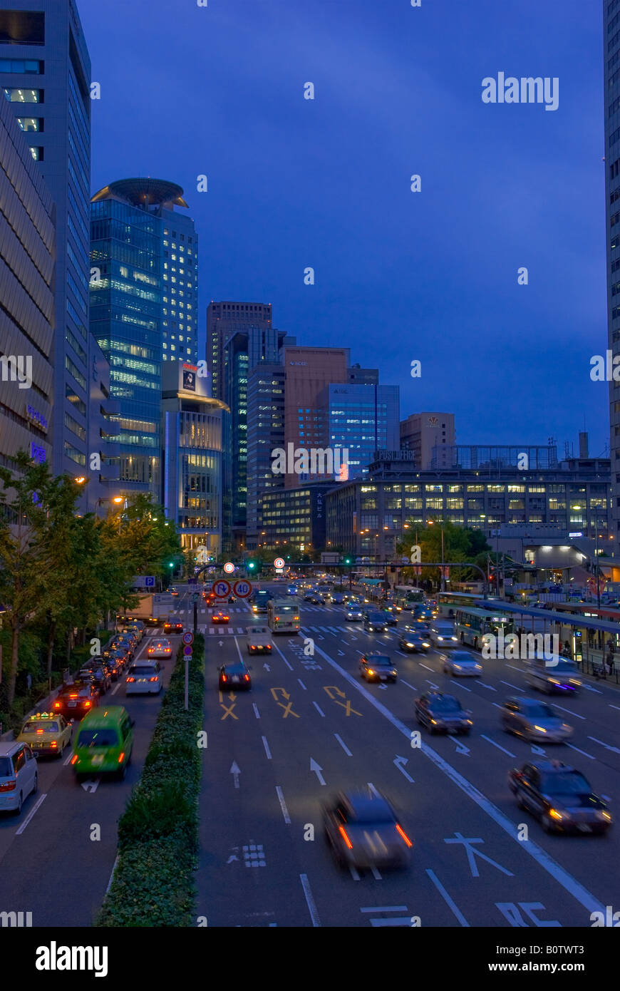 Japan Osaka Umeda Neon lights and traffic blur at dusk high angle view ...