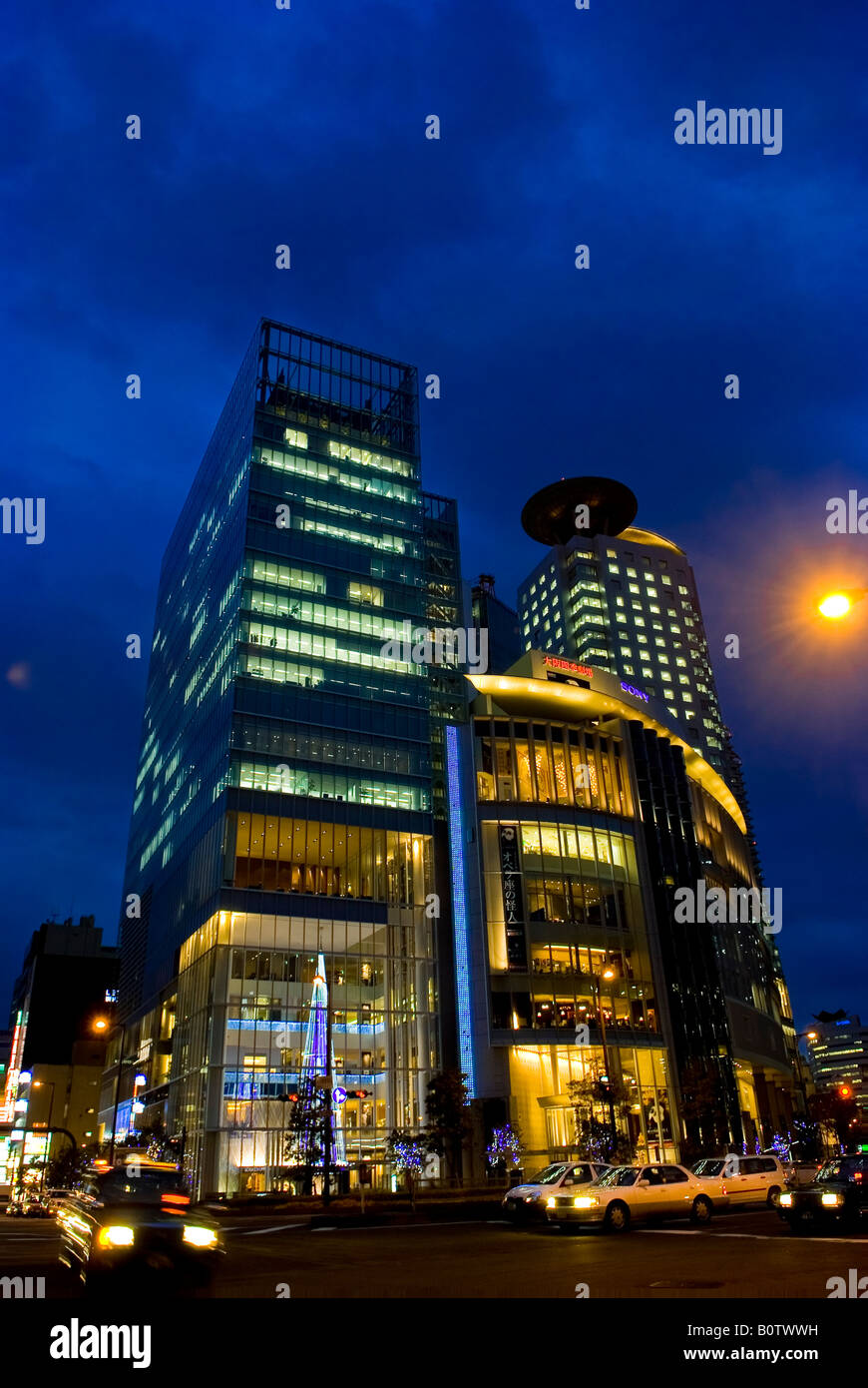 Japan Osaka Umeda Neon lights and traffic blur at dusk high angle view ...