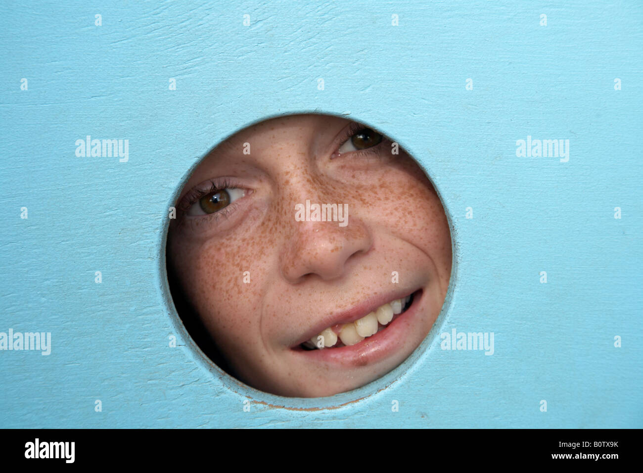 childs face at round window Stock Photo - Alamy