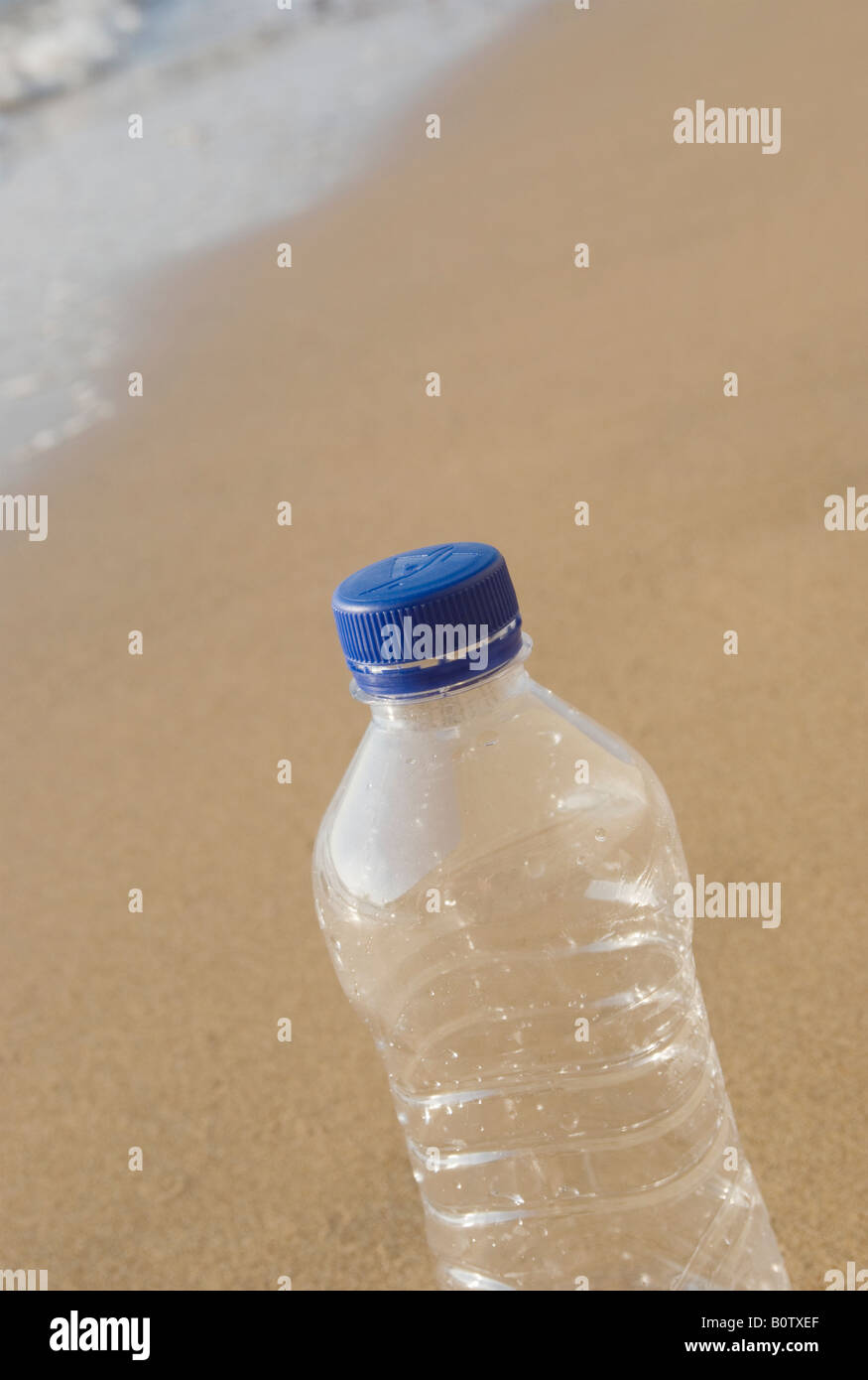 empty plastic bottle on the shoreline Stock Photo - Alamy