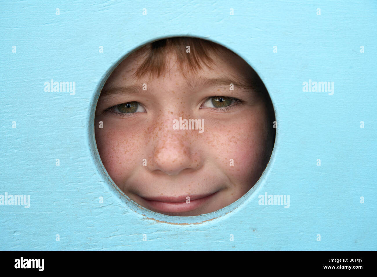 childs face at round window Stock Photo - Alamy
