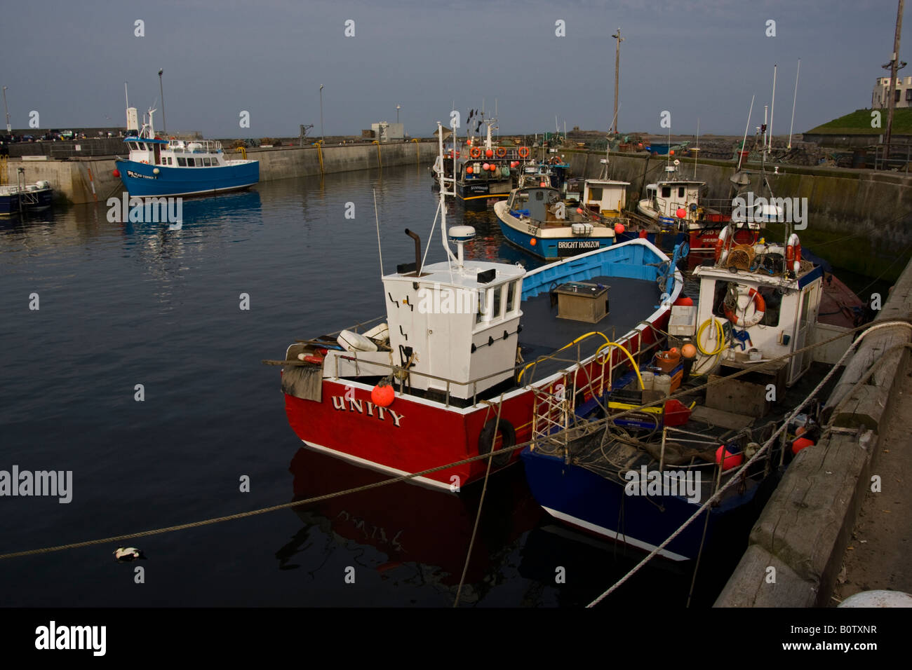 fishing boats in harbour seahouses northumberland Stock Photo - Alamy