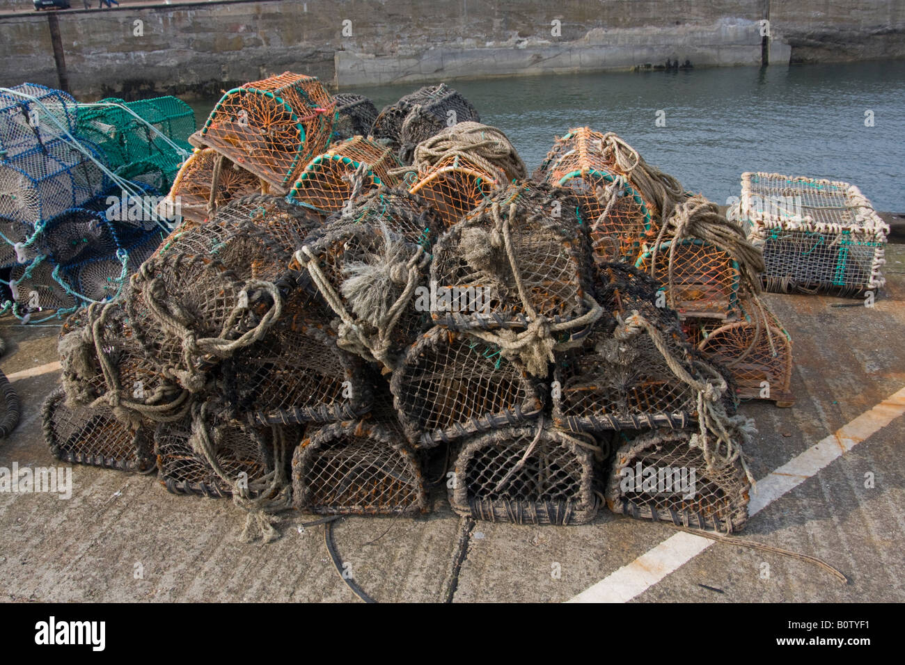 lobster pots in harbour at seahouses northumberland Stock Photo - Alamy