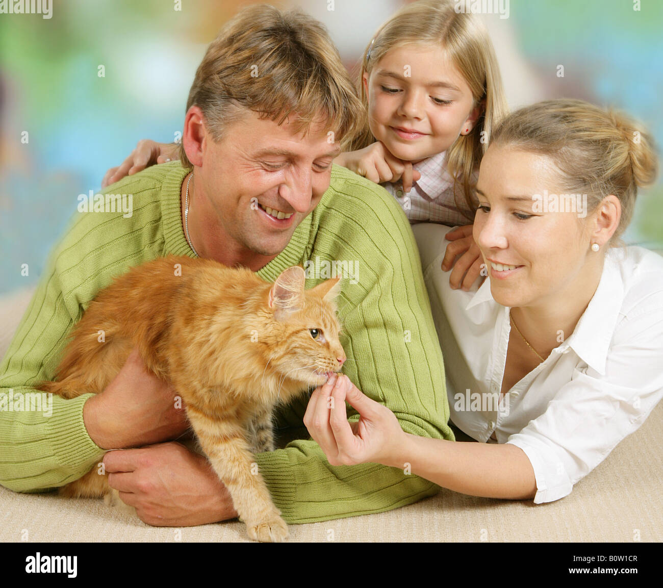 family with cat Stock Photo - Alamy