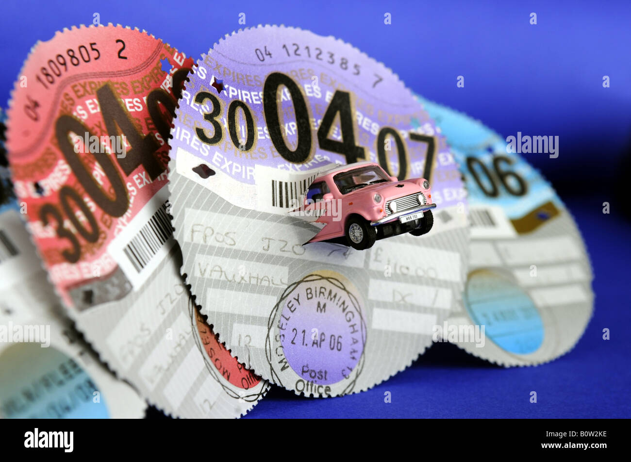 BRITISH CAR TAX DISCS WITH ROVER MINI CAR,UK Stock Photo - Alamy