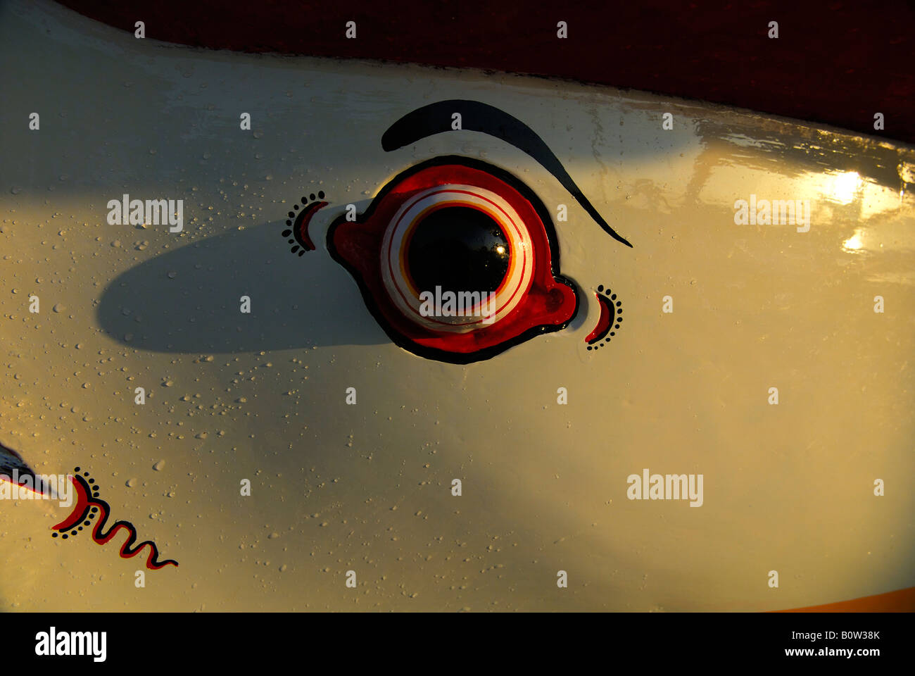 detail of eye painted on a traditional Balinese outrigger canoe, a ...