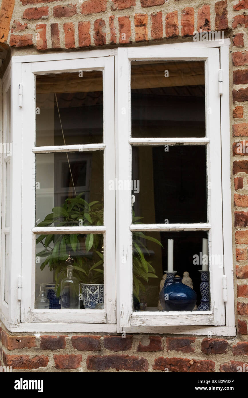 Danish window in Ribe, Jutland with typical Danish pottery and flower ...
