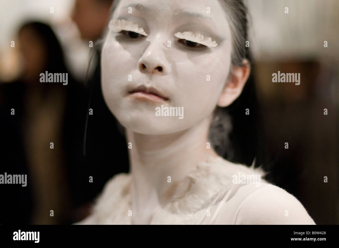 actress performing mimic with white make up and fake eyelush Stock ...