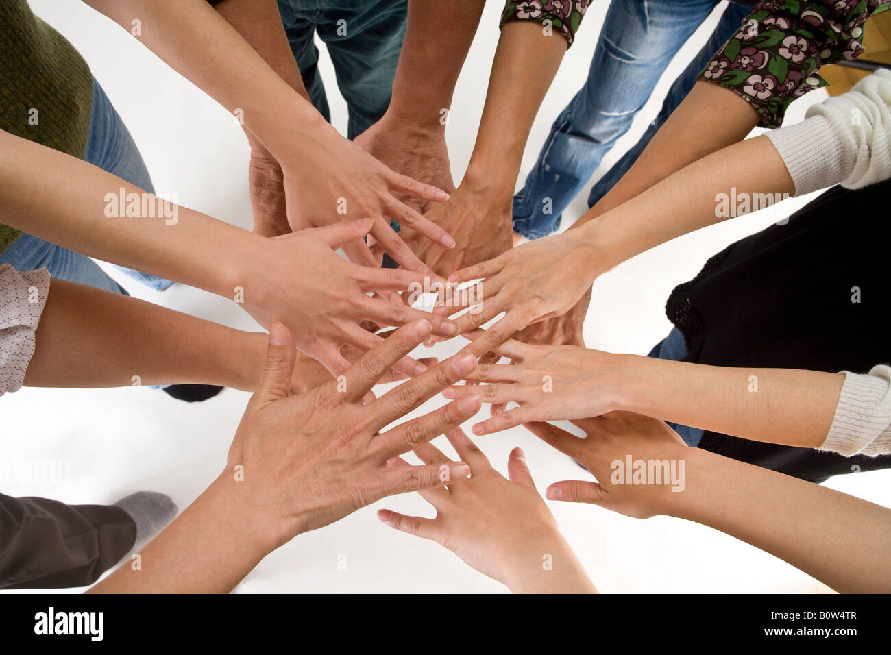 Group of people in huddle Stock Photo - Alamy