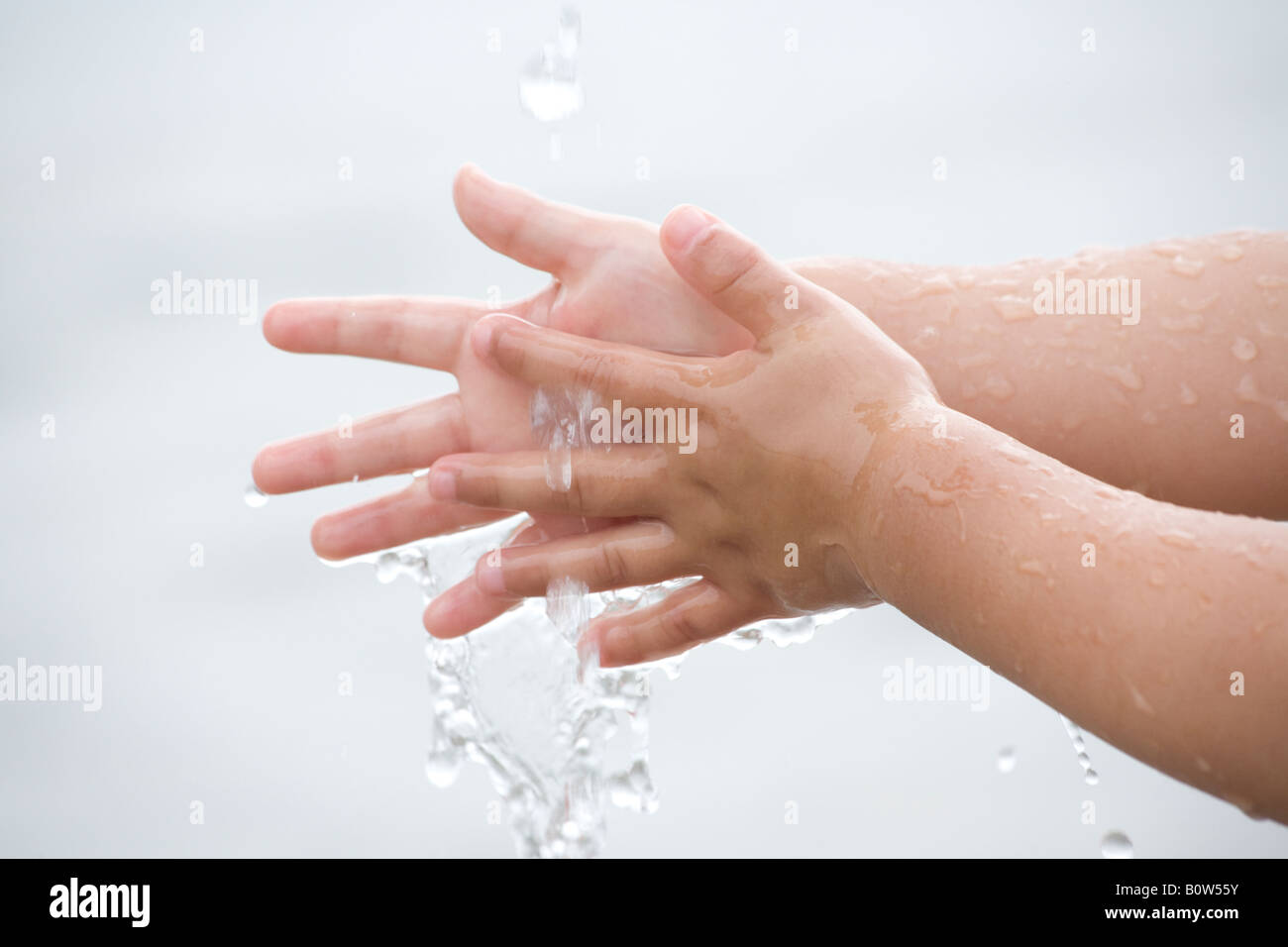 Child touching water hi-res stock photography and images - Alamy