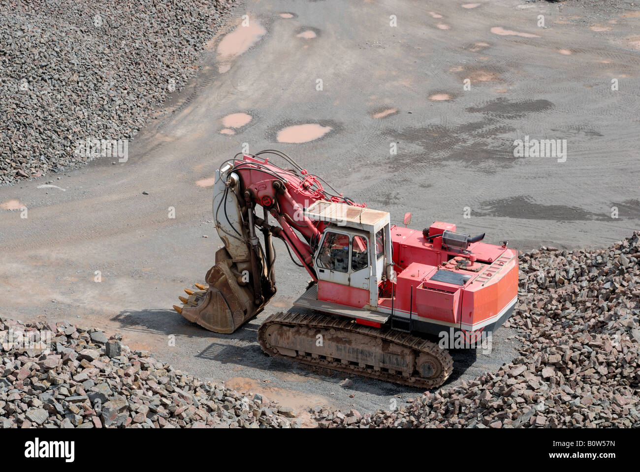 Excavator in a stone pit Stock Photo - Alamy