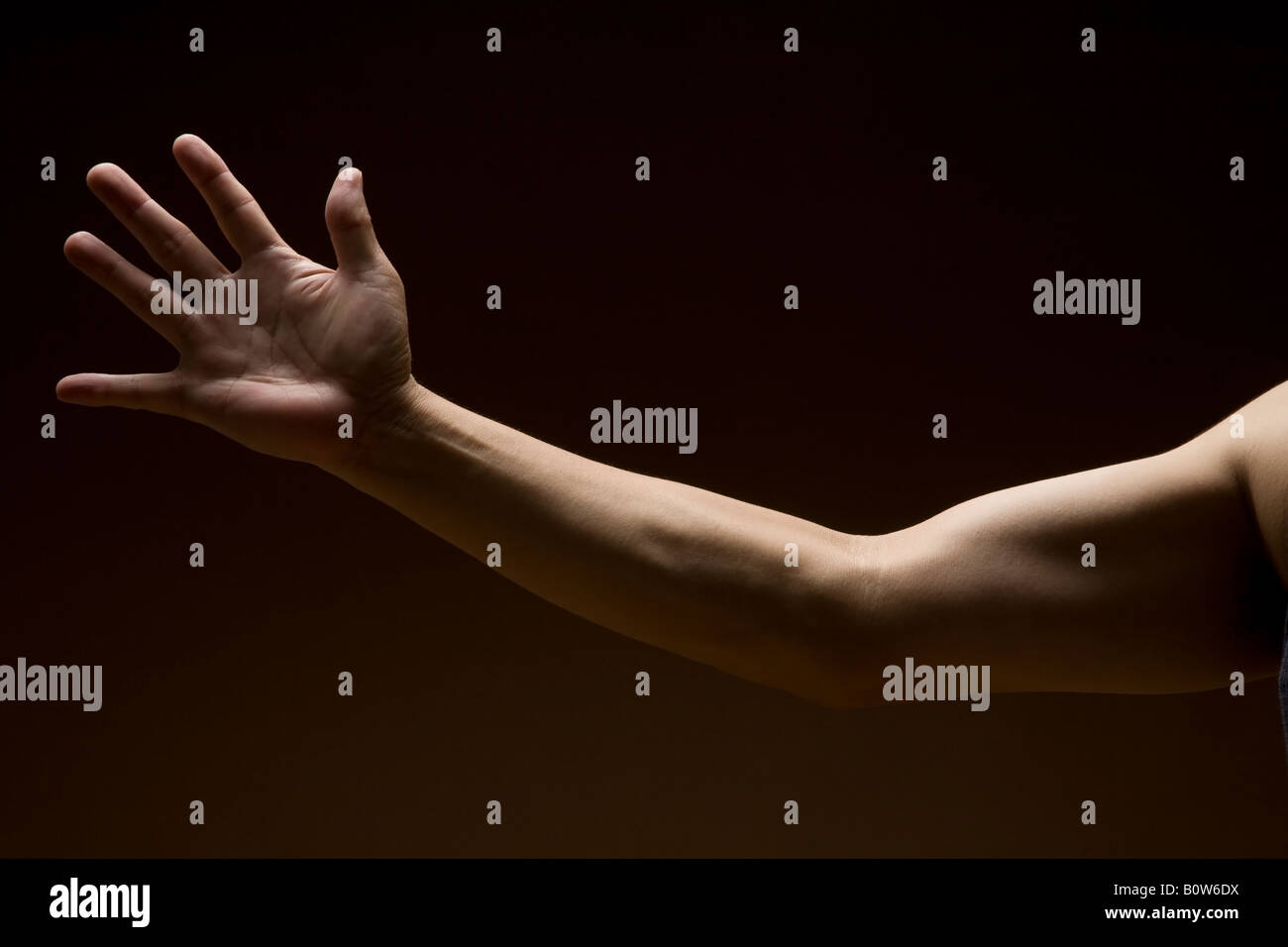 Man's arm and open hand Stock Photo - Alamy