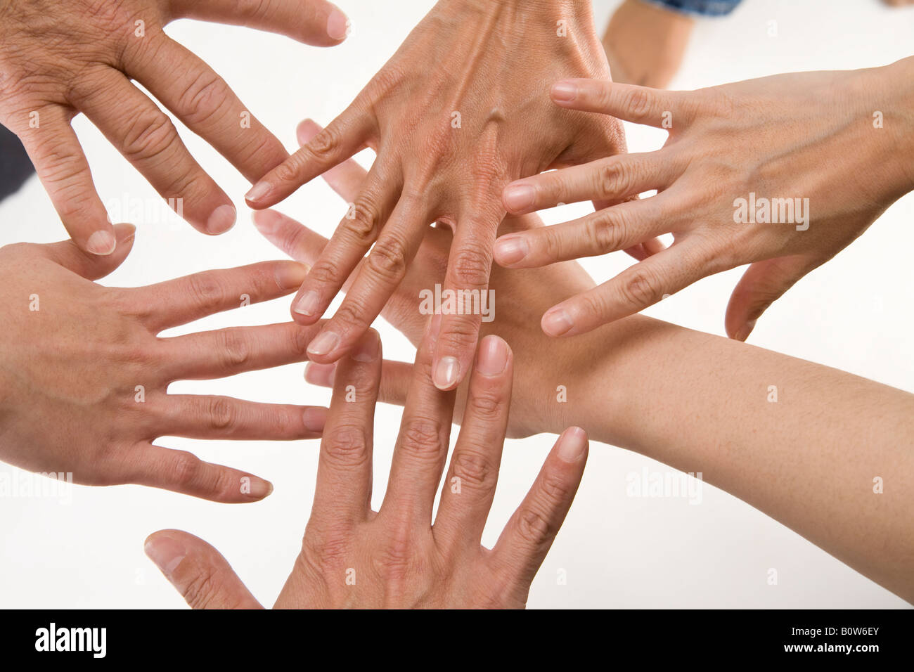Group of people in huddle Stock Photo - Alamy
