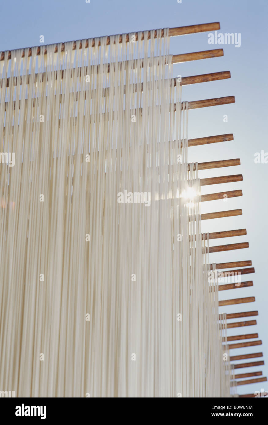 Noodles hanging on poles Stock Photo - Alamy