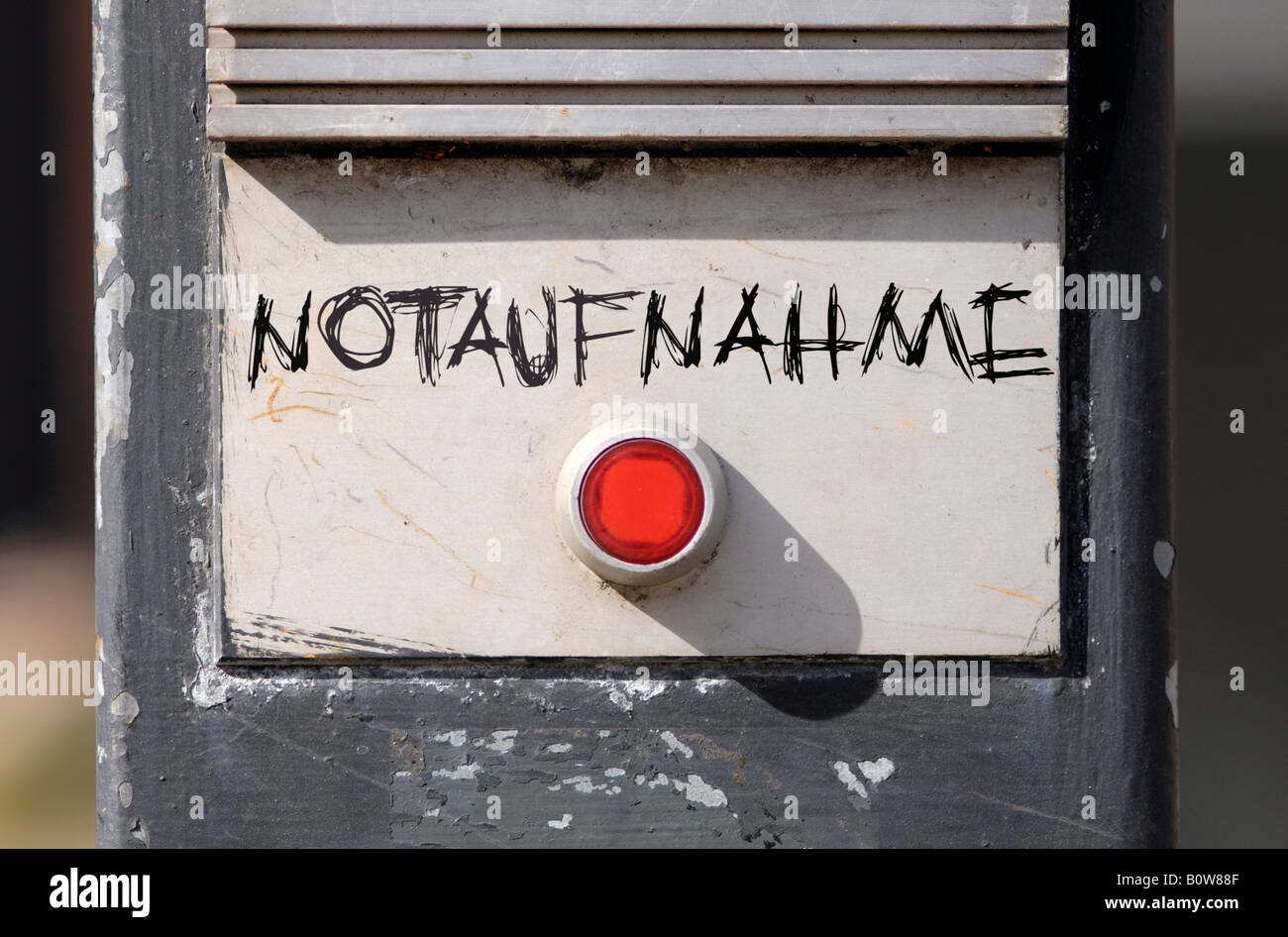 Red doorbell button, "Notaufnahme" (emergency room) in writing Stock ...
