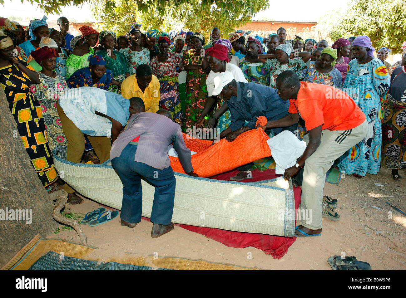 Funeral of a woman who died of HIV/AIDS, body wrapped in sheets, Garoua ...
