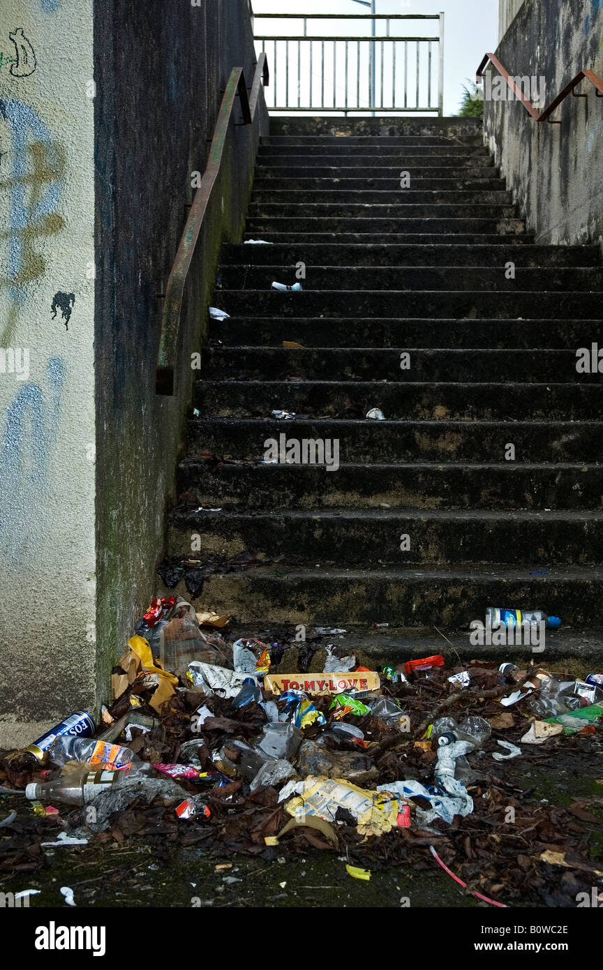 litter and rubbish scattered at the bottom of steps leading to a subway ...