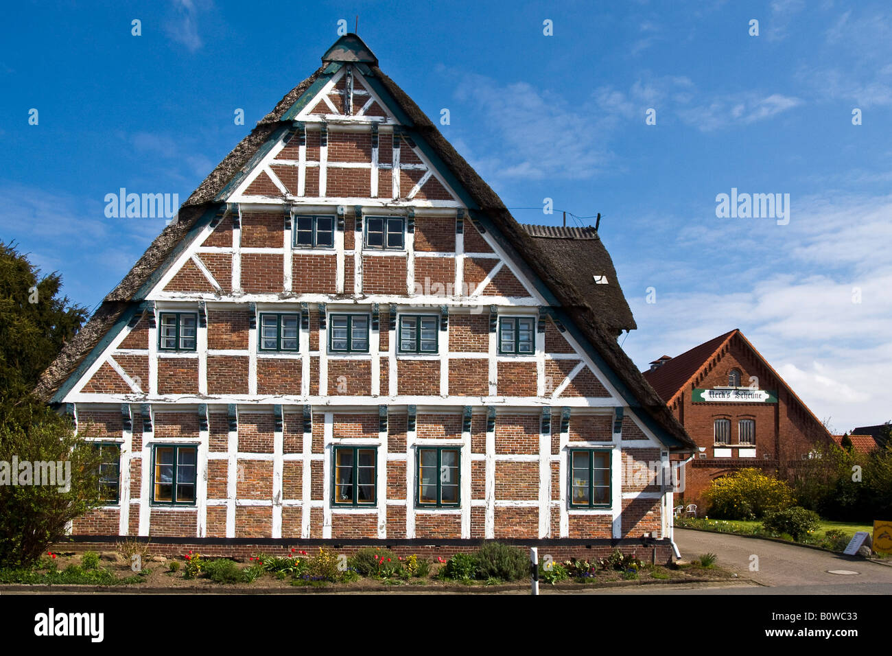 Historic timber-framed house, old farmhouse with thatched roof, Jork ...