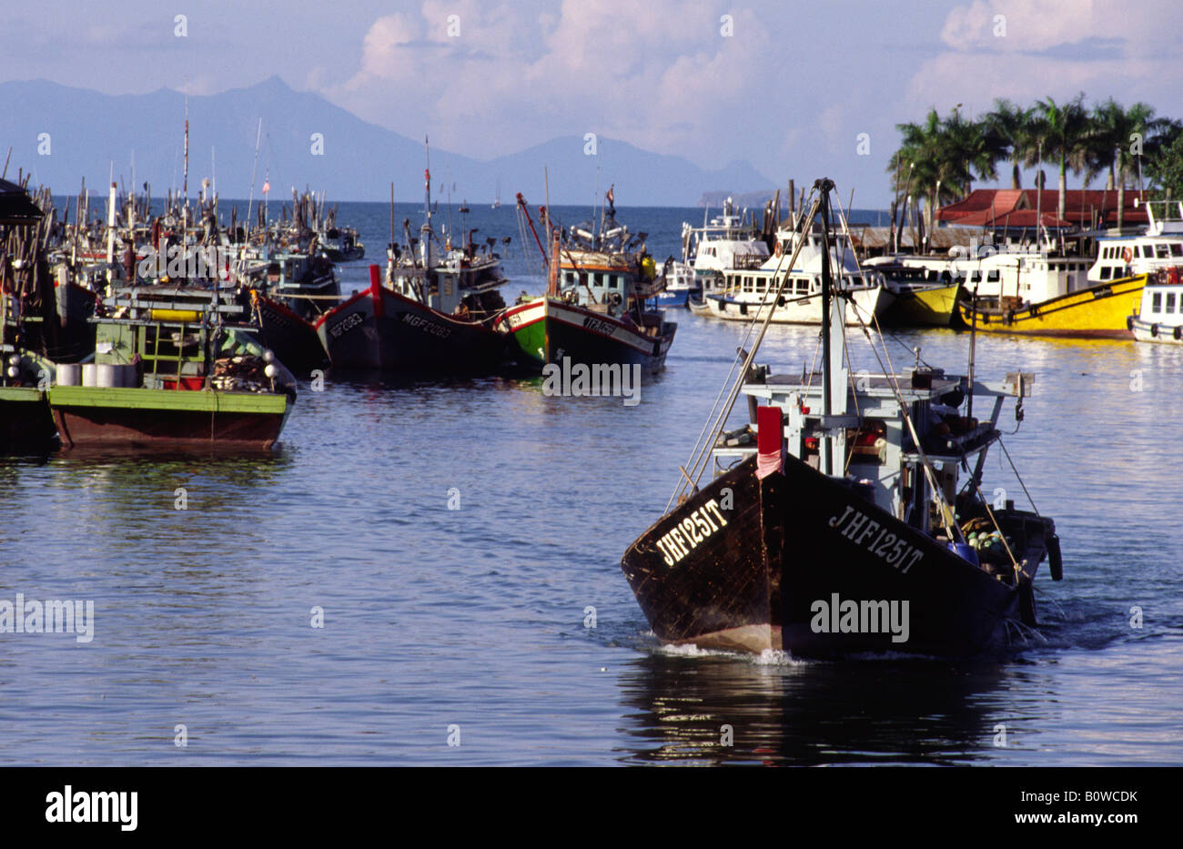 Fishing harbor with Tioman Island in the background. Mersing, Johor ...