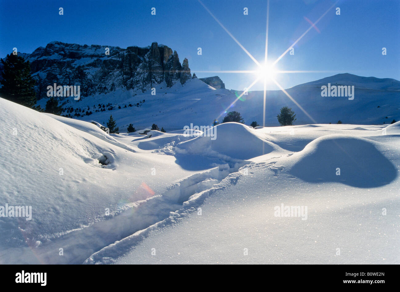 Twinkling sun and landscape deeply covered in snow, Sella Pass in ...