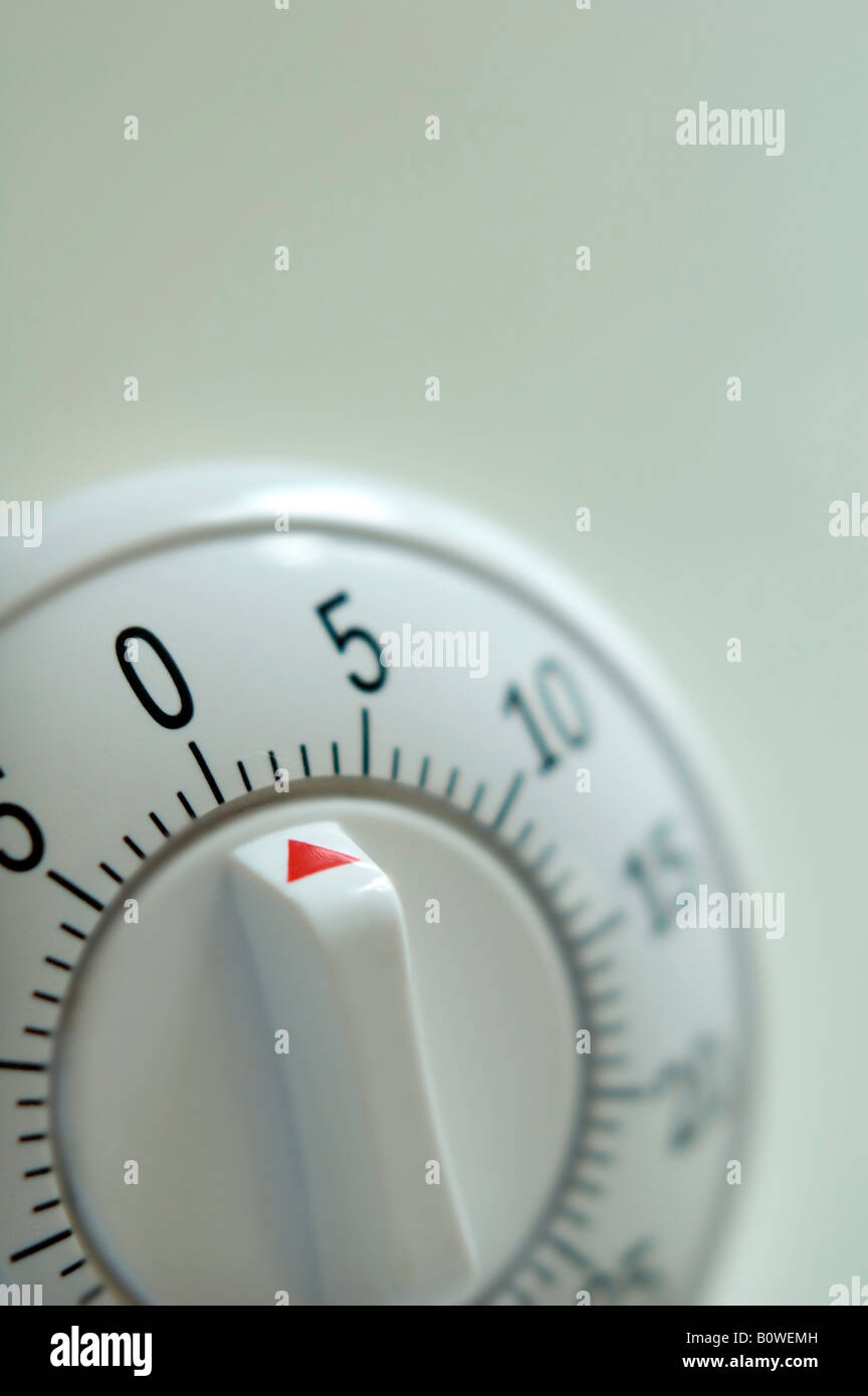 White kitchen clock in front of white background Stock Photo - Alamy