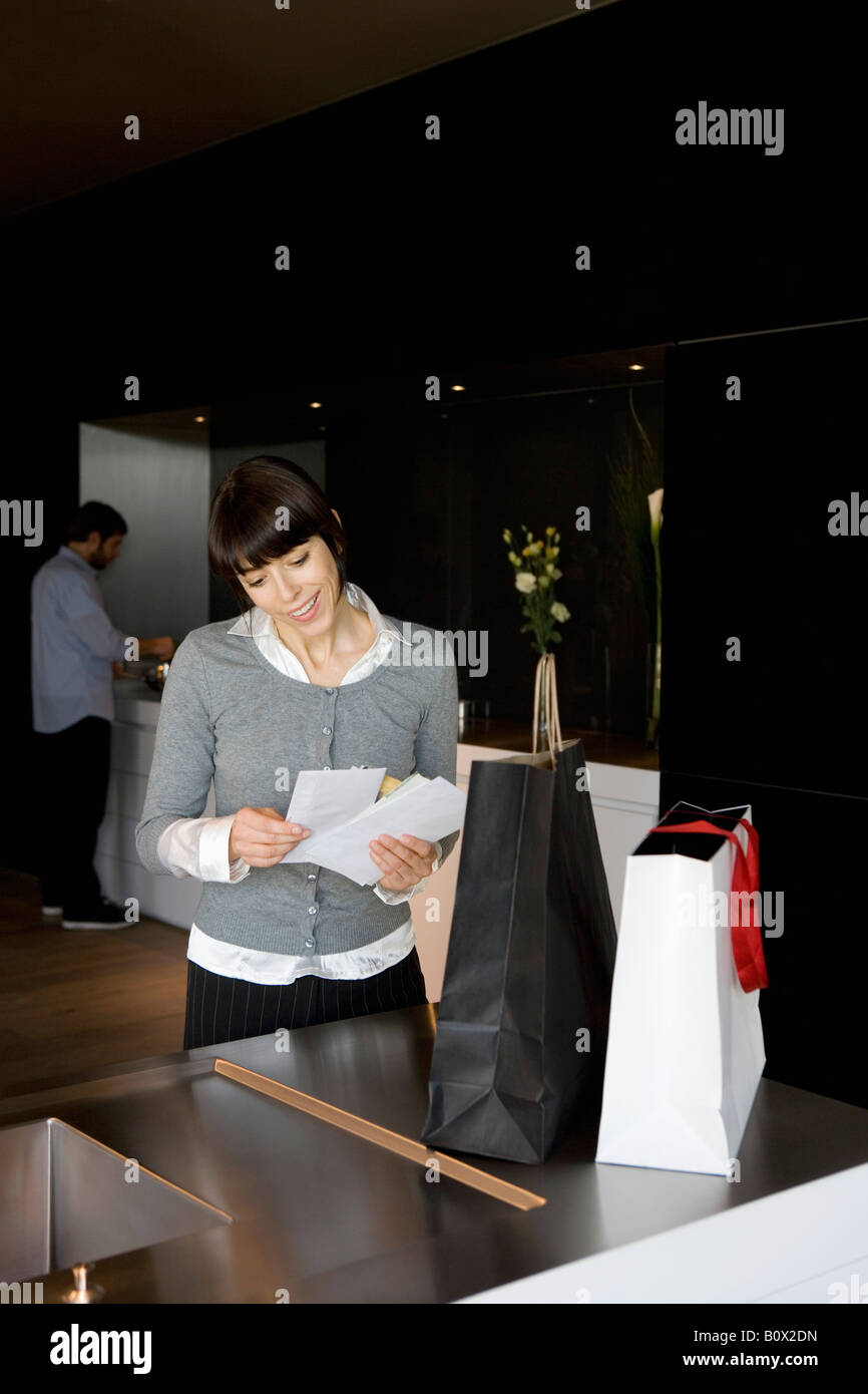 A woman reading the mail Stock Photo - Alamy