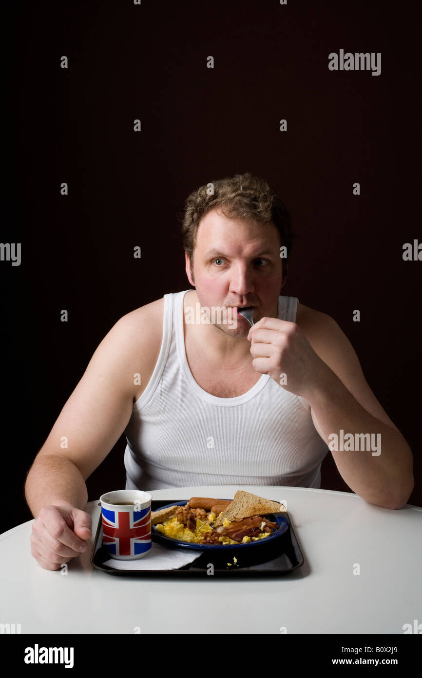 Stereotypical Englishman eating English breakfast Stock Photo - Alamy