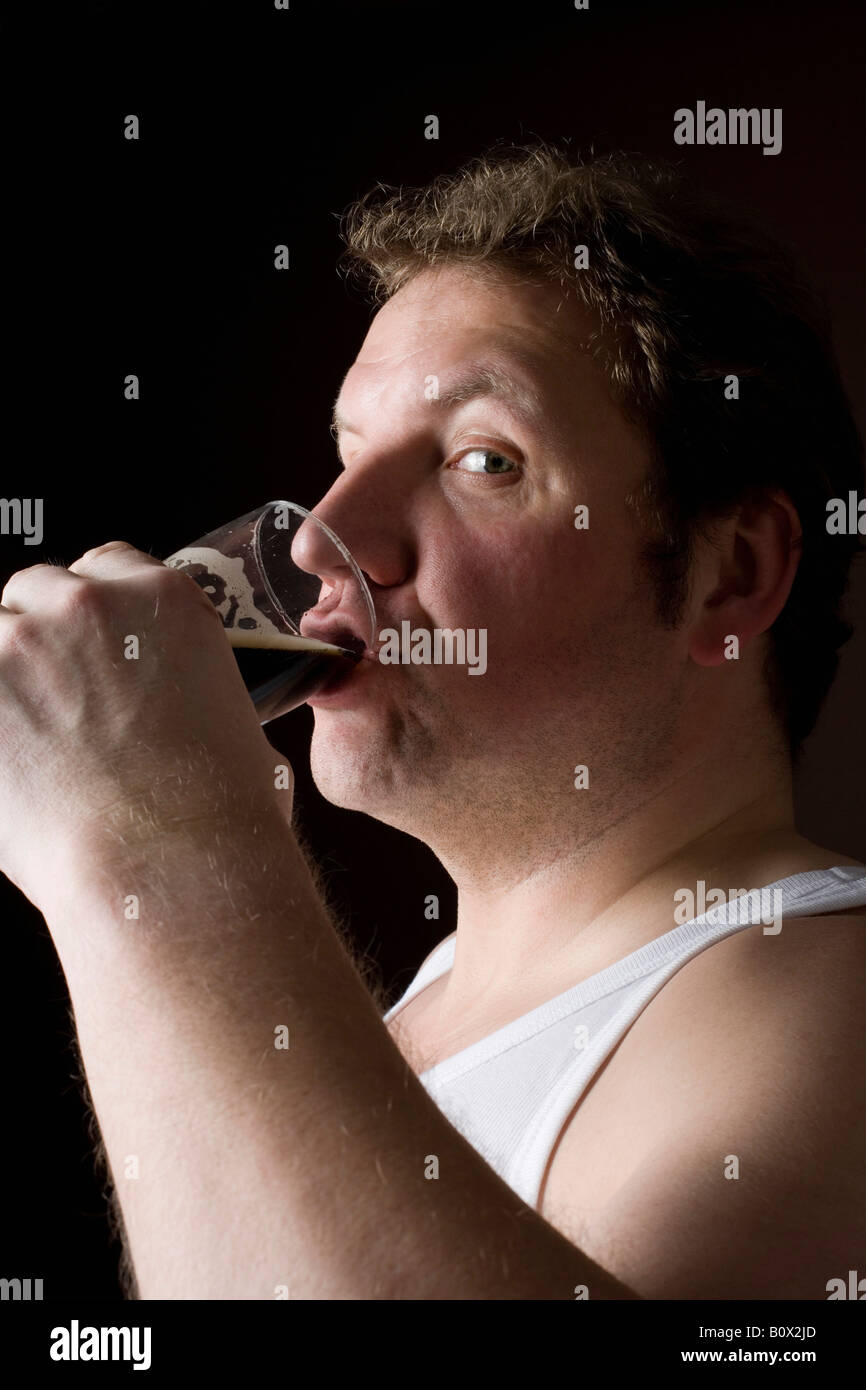 Profile portrait of a stereotypical Englishman drinking a pint Stock ...