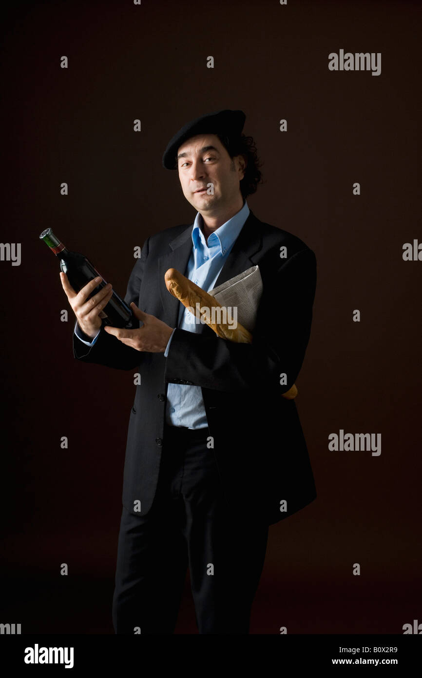 Stereotypical French man holding a bottle of wine, baguette and a ...